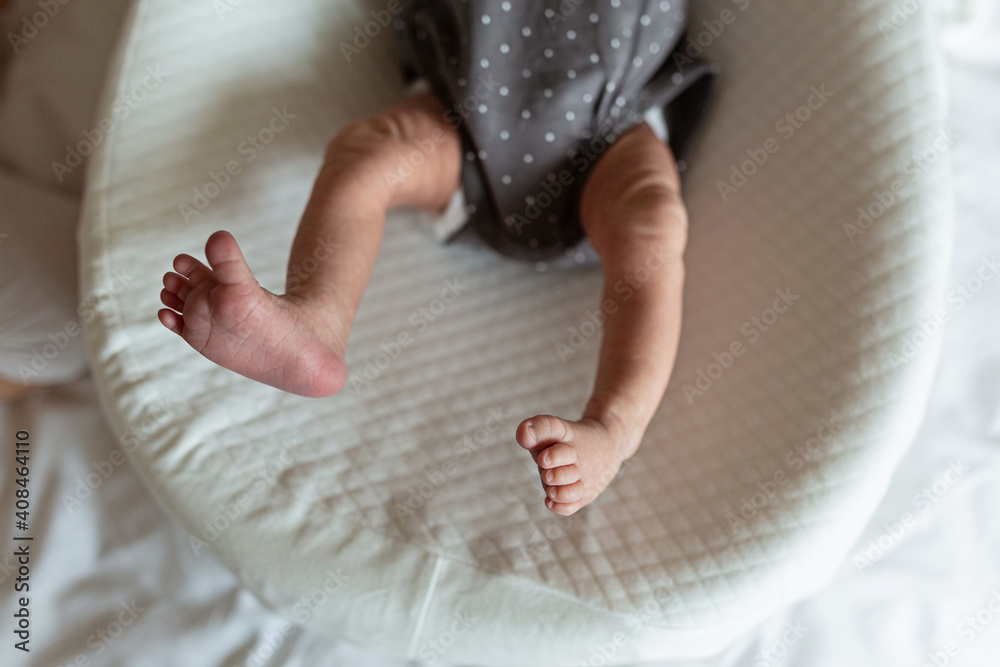 Newborn Baby in white cocoon. health care, hygiene, happy family ...