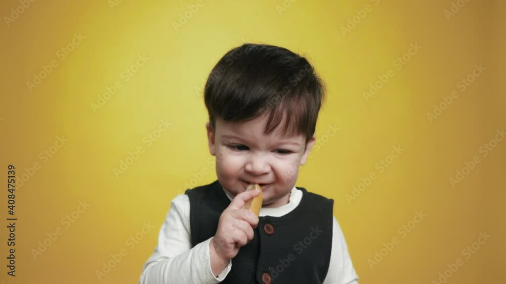 Vidéo Stock One Cute Beautiful Baby Eating a Lemon. A Child Tastes the ...