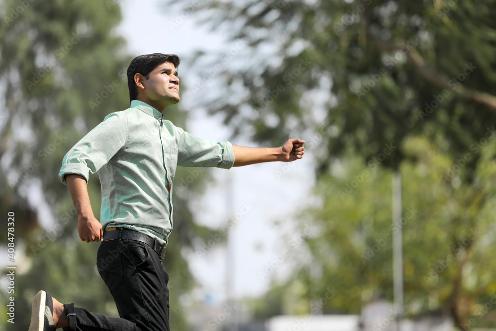 Young indian man Jump in air after achieving success. Stock Photo ...