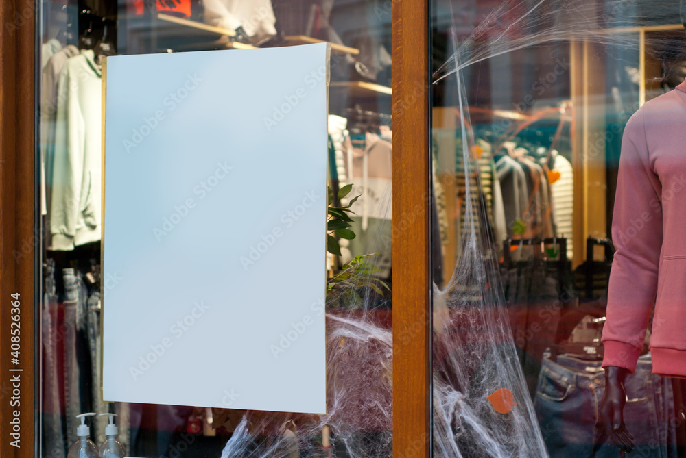 Banner for advertising in a shop window. Clothing store window with ...