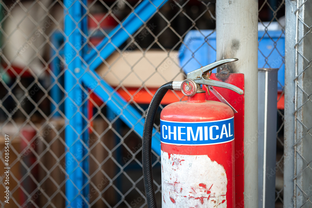 A chemical fire extinguisher which is installed at factory storage ...