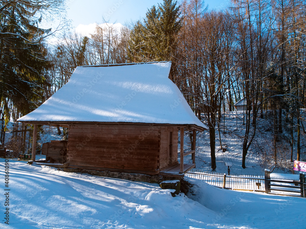 Wooden vintage country house in mountains forest covered with snow on ...