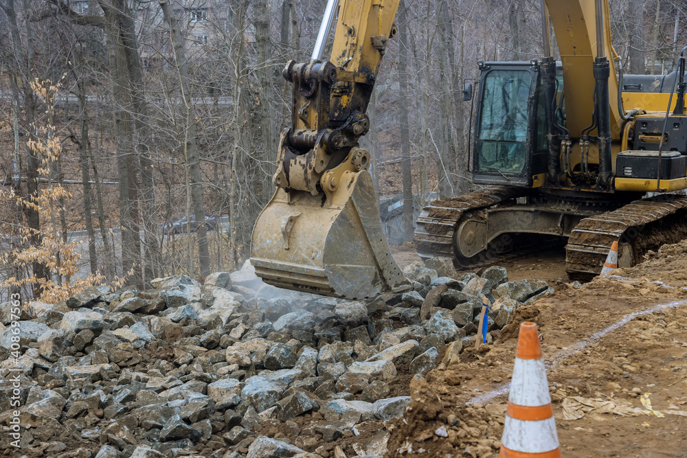 Heavy trucks with moving stone rock in a construction site on load ...