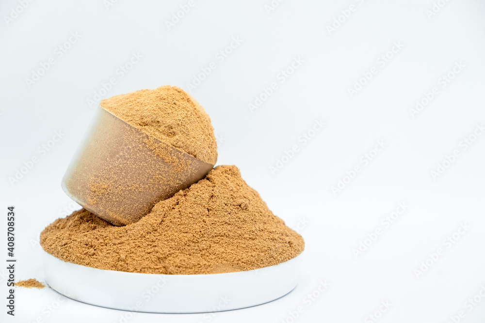 Whey protein powder on white background. Plastic measuring dietary ...