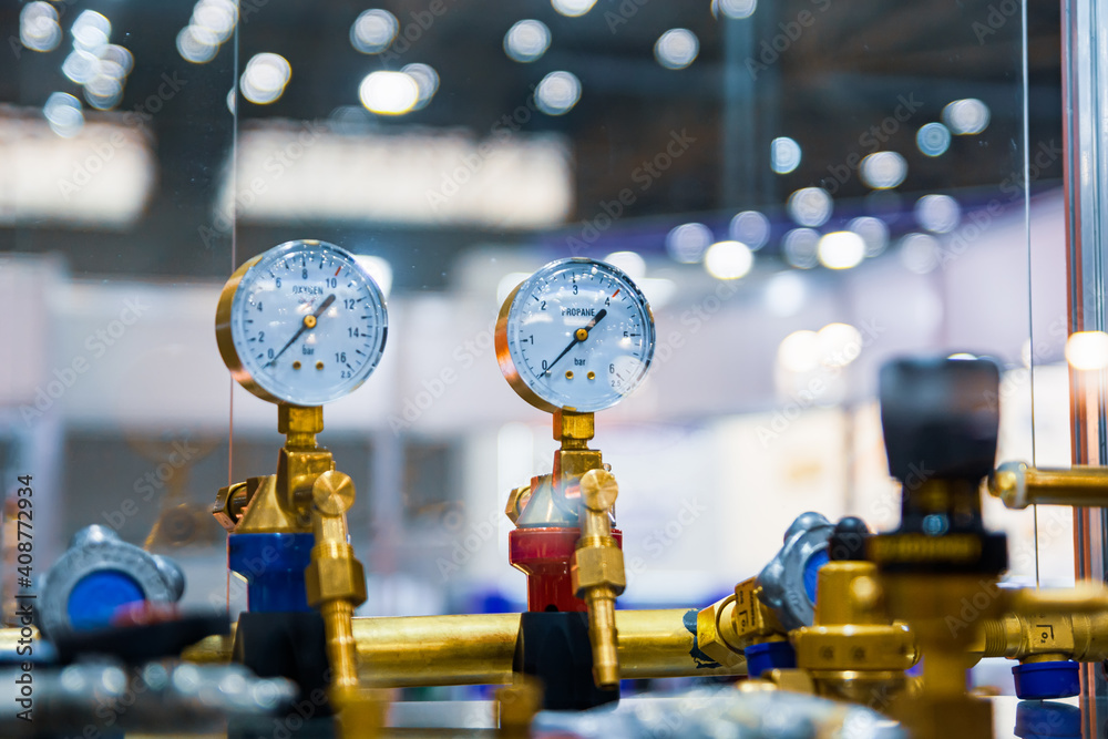 Cylinder gas reducers with pressure gauge Stock Photo | Adobe Stock