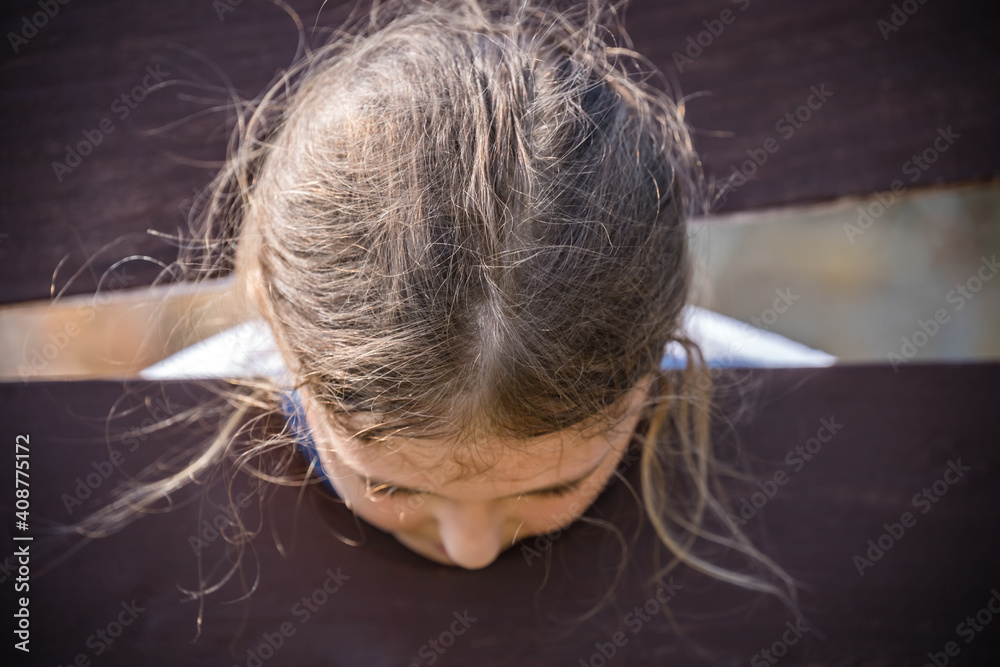 Blond child being executed by a guillotine Stock Photo | Adobe Stock