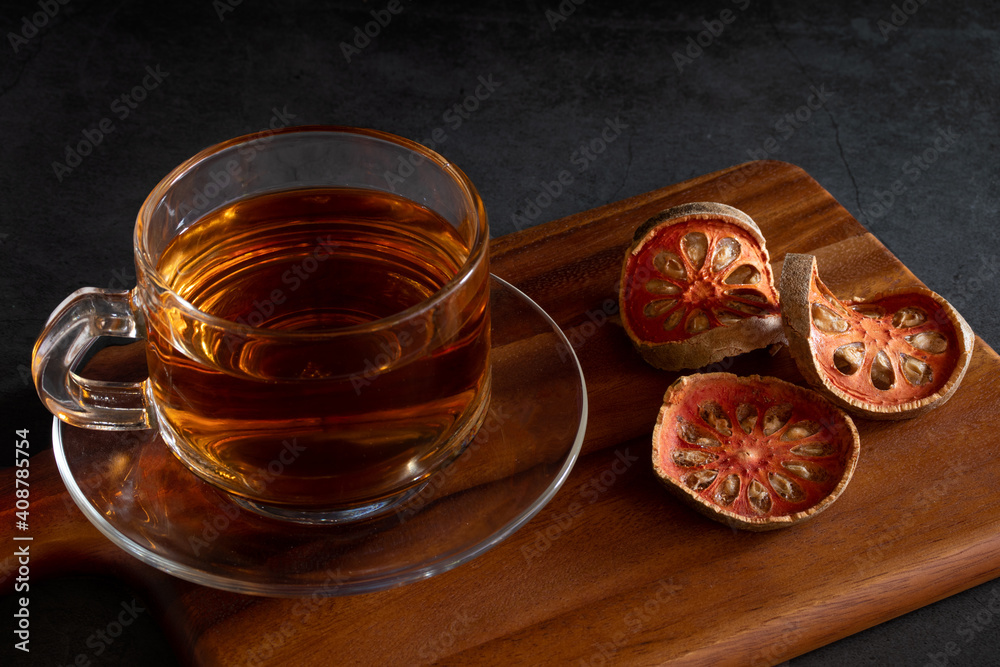 Hot bael fruit tea in a clear cup with hot steam Bael Fruit Tea made ...