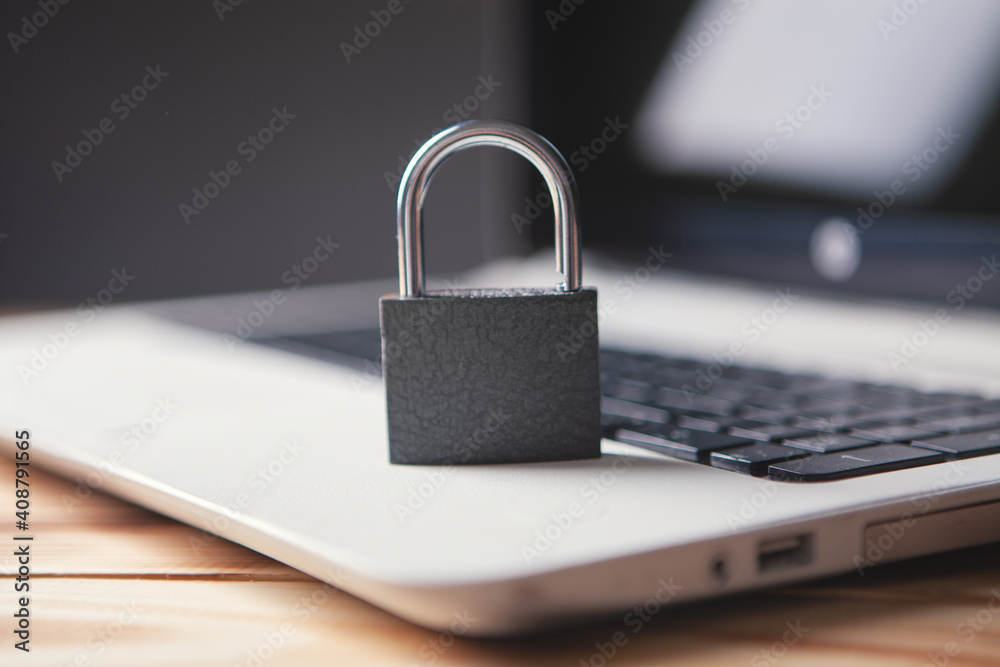 Lock on laptop as computer protection and cyber safety Stock Photo ...