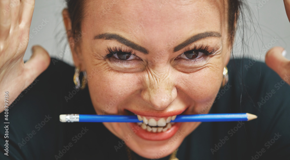 Anger Stress And Frustration Of A Business Woman Biting A Pencil As A