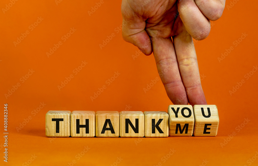 Thank you or me symbol. Businessman turns cubes and changes words ...