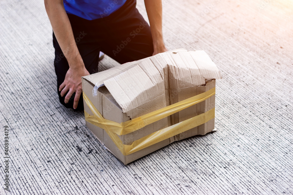 Asian delivery man in blue uniform he emotional falling courier courier ...