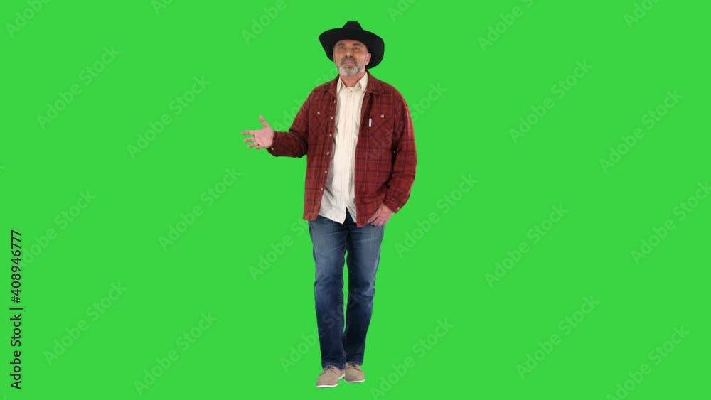 Ranch owner in a cowboy hat walking and telling a story on a Green ...