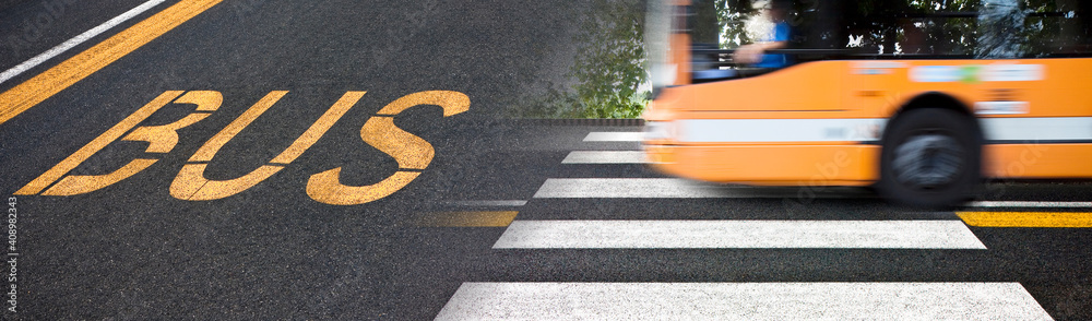 Urban scene with yellow bus sign written on the asphalt with pedestrian ...