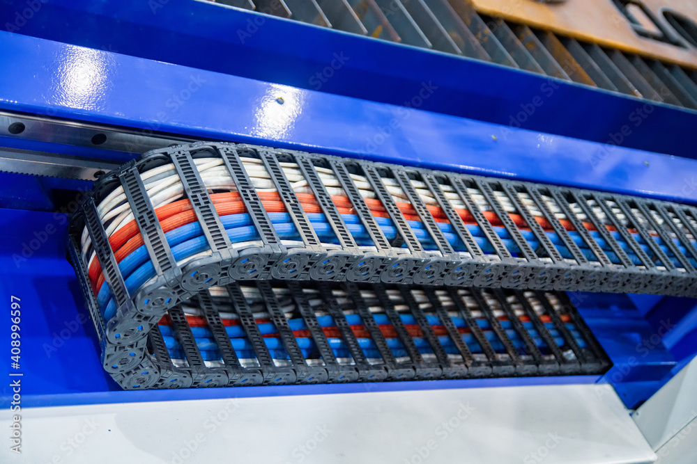 Plastic cable chain of electrical wires in the machine Stock Photo ...