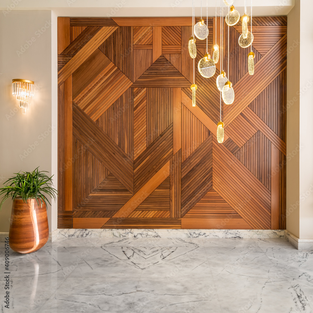 Hall with wood cladding wall decorated with geometrical patterns, tall ...