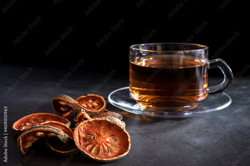 Matum tea. Bael fruit tea and slices of dried bael fruit Stock Photo ...