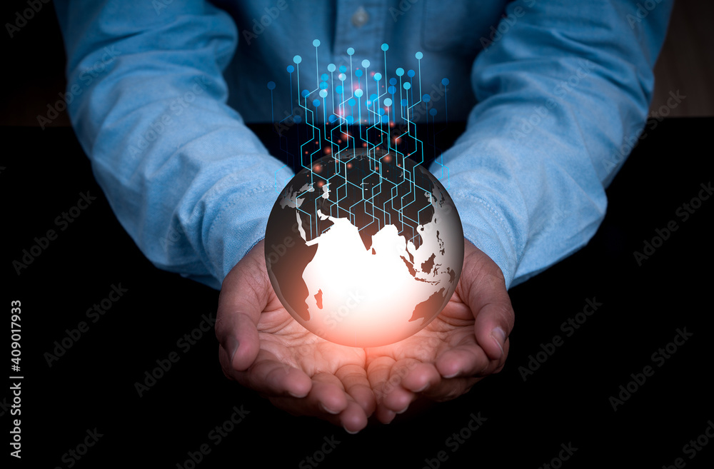 Business man hand holding earth orange light network technology drak ...