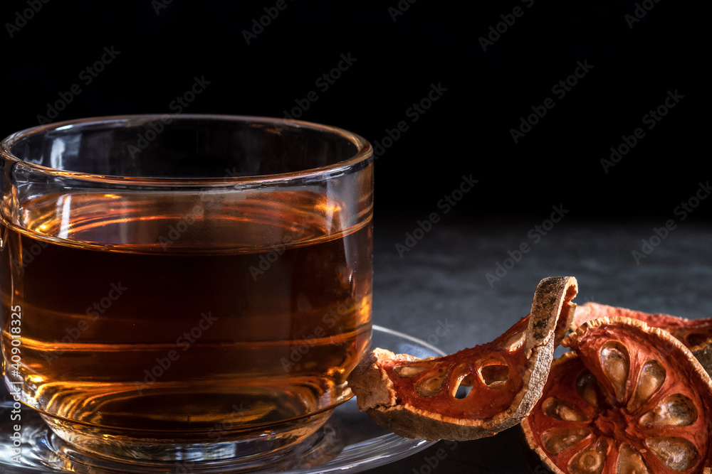 Matum tea. Bael fruit tea and slices of dried bael fruit Stock Photo ...