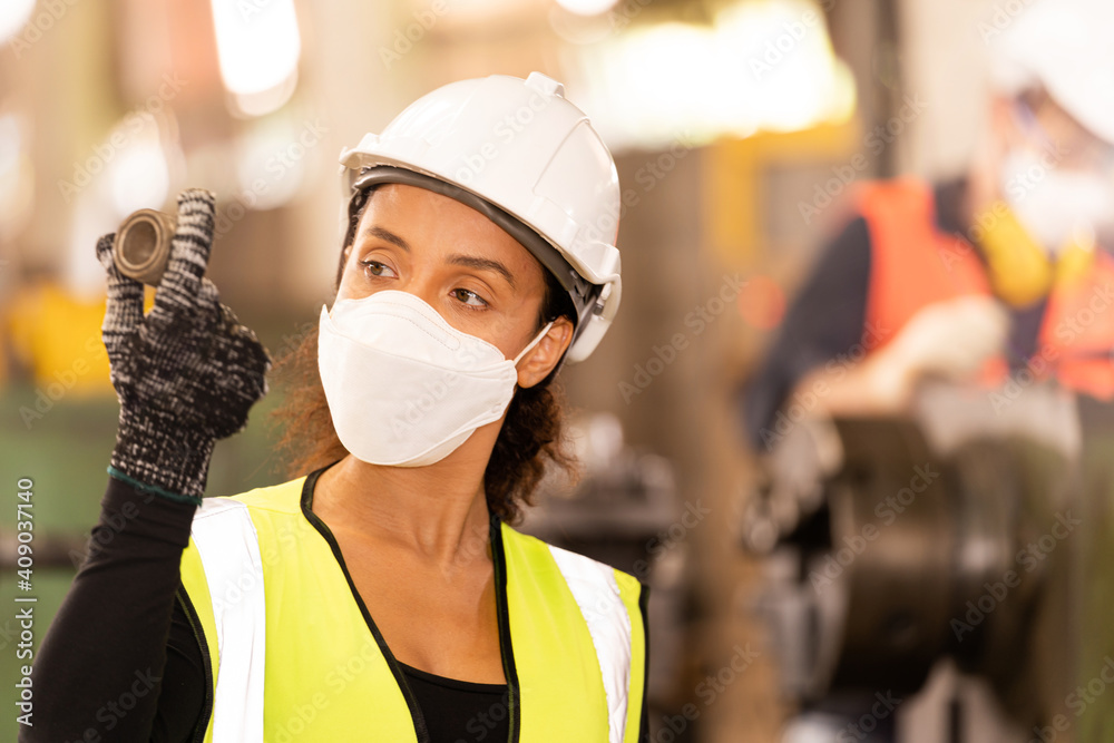 workers factory Brazilian woman wearing Face Shield mask and working at ...