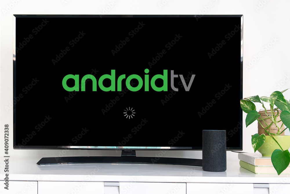 Android TV running on a smart tv in a living room. No people and empty ...