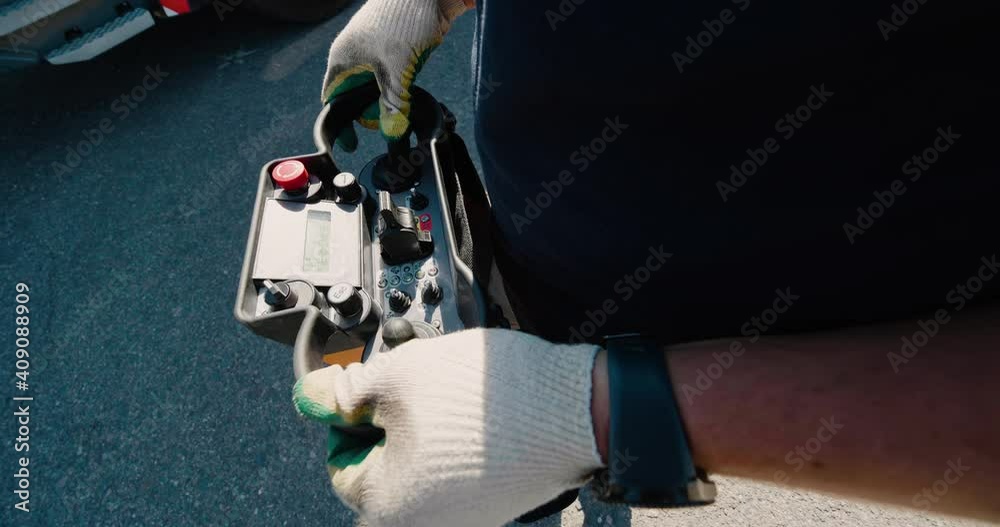 Portable control station in the hands of a construction crane operator ...