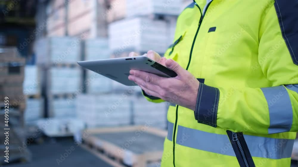 Worker male warehouse worker engineer man in a helmet working on the ...