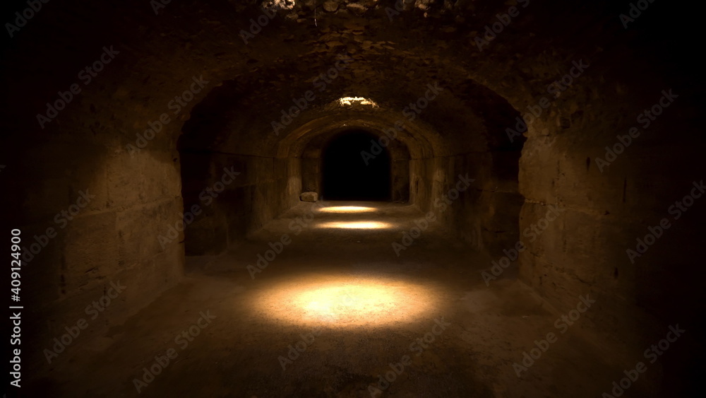 Pass through a long and dark Roman basement. Basement under the ...