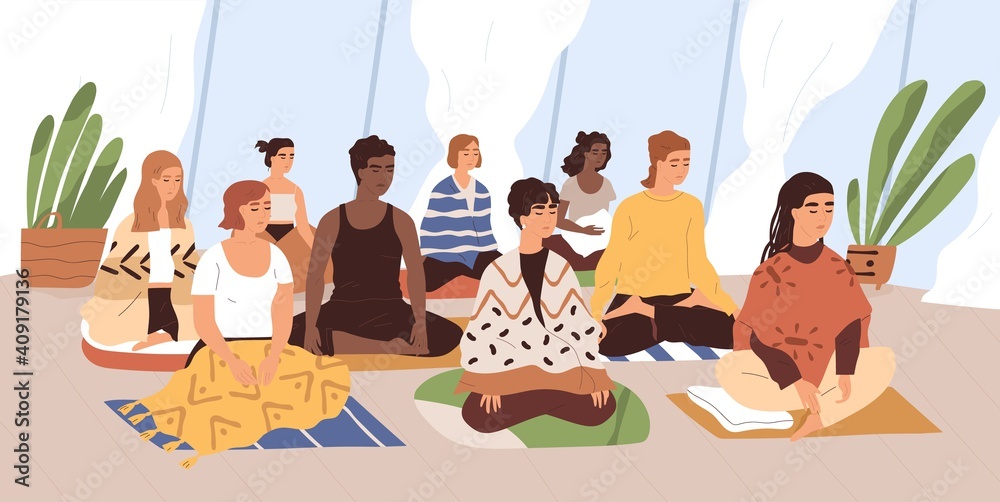Group of young women sitting on mats, meditating and performing breath ...