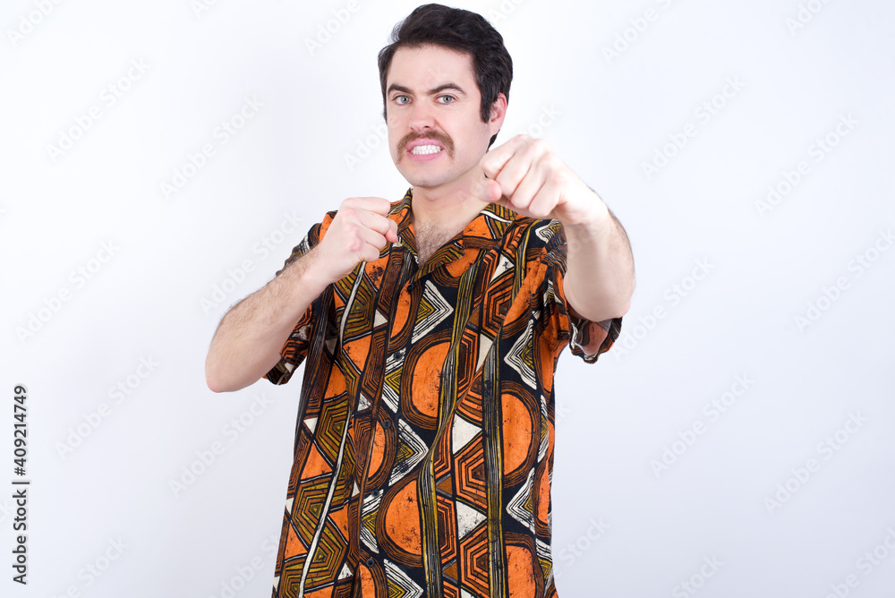 Young caucasian man wearing generic pattern printed shirt against ...