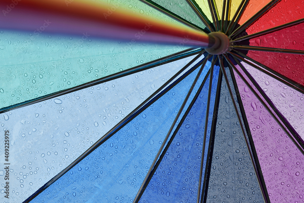 Umbrella in rainbowcolors with raindrops from inside, vibrant colors in ...