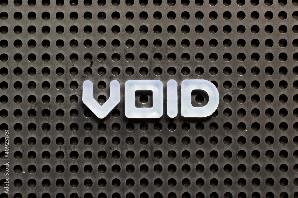 White color letter in word void on black pegboard background Stock ...