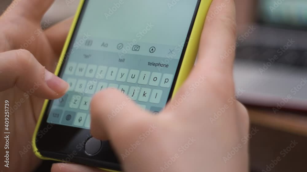 close-up of phone, woman is types note, writes message, puts ...