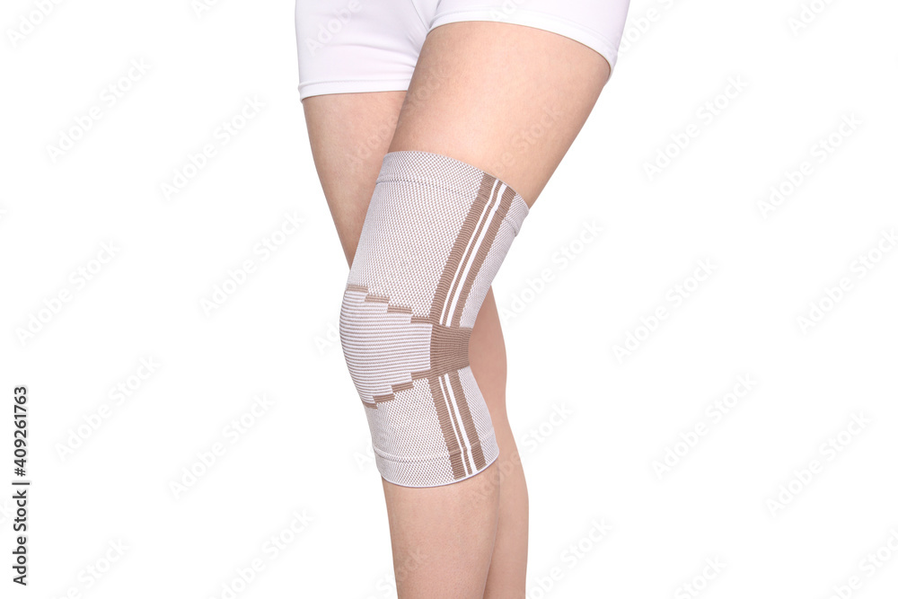 Knee Support Brace on leg isolated on white background. Orthopedic ...