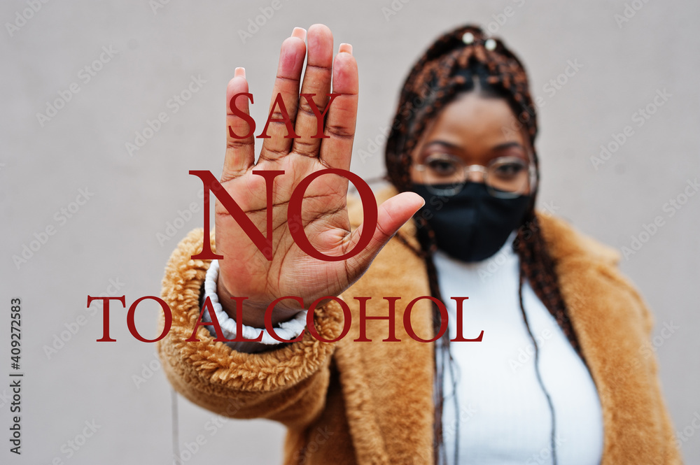 Say no to alcohol. African american woman, wear black face mask show ...