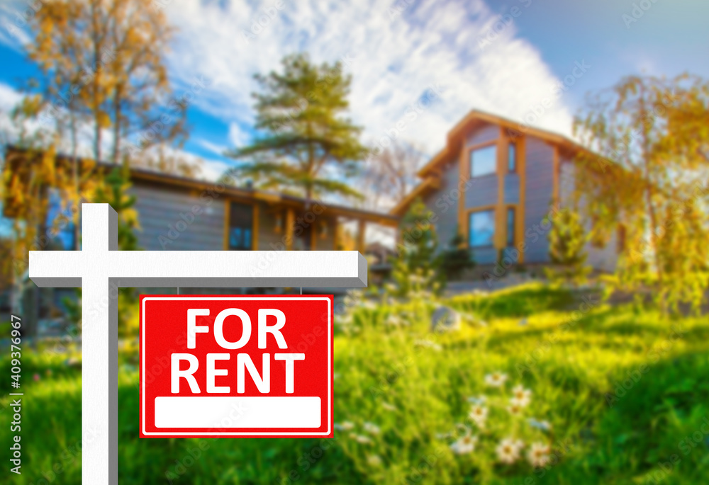 For rent sign next to a large house. For rent sign as a symbol of ...