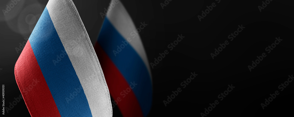 Small national flags of the Russia on a dark background Stock Photo ...