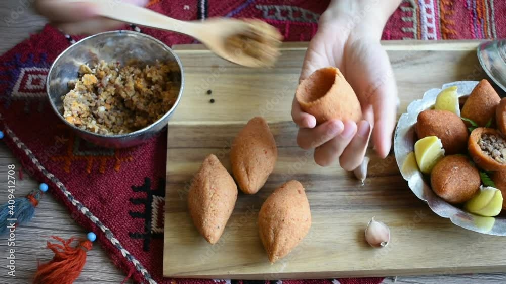 Traditional Turkish Foods; "icli kofte", a woman making stuffed ...