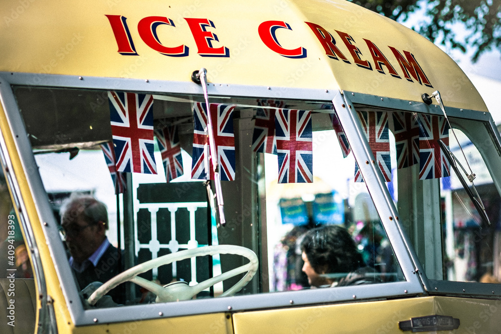 Vintage British ice cream van with union jack flags in the windscreen ...