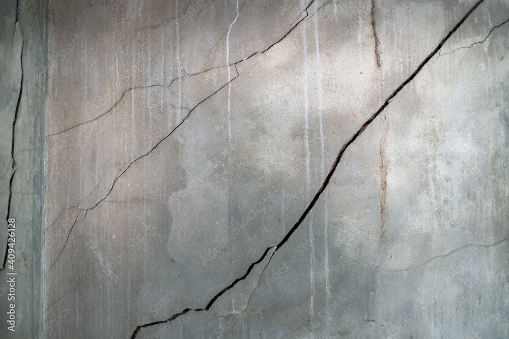 Longitudinal cracks in concrete cement wall in the house where no ...