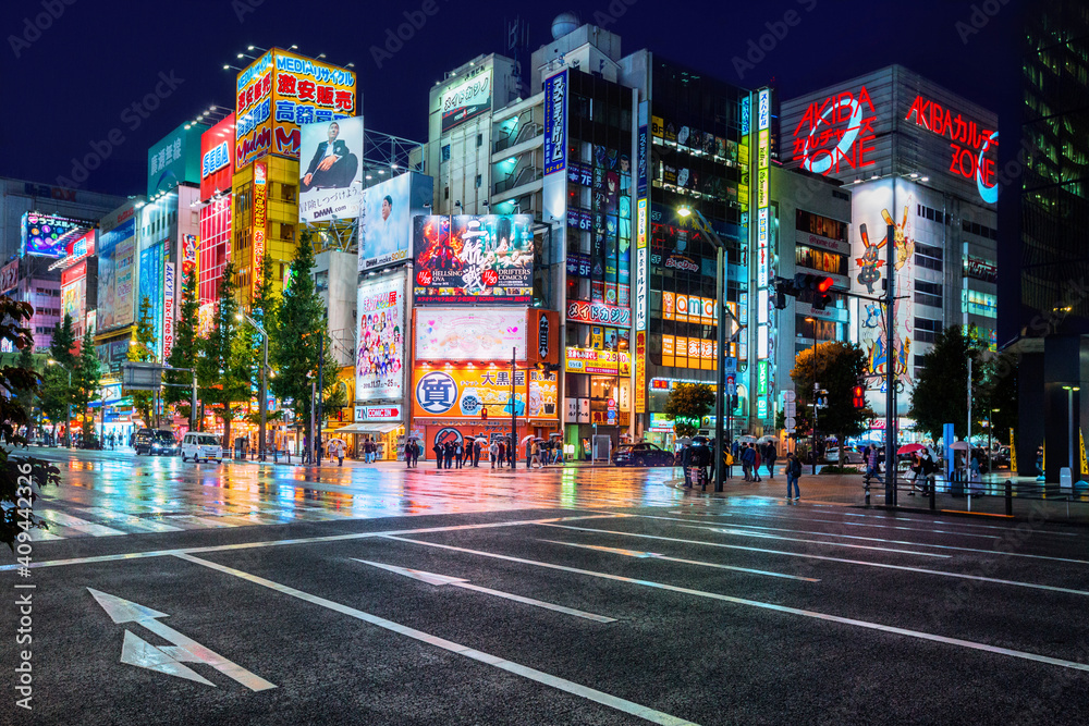 Neon lights and billboard advertisements on buildings at Akihabara at ...