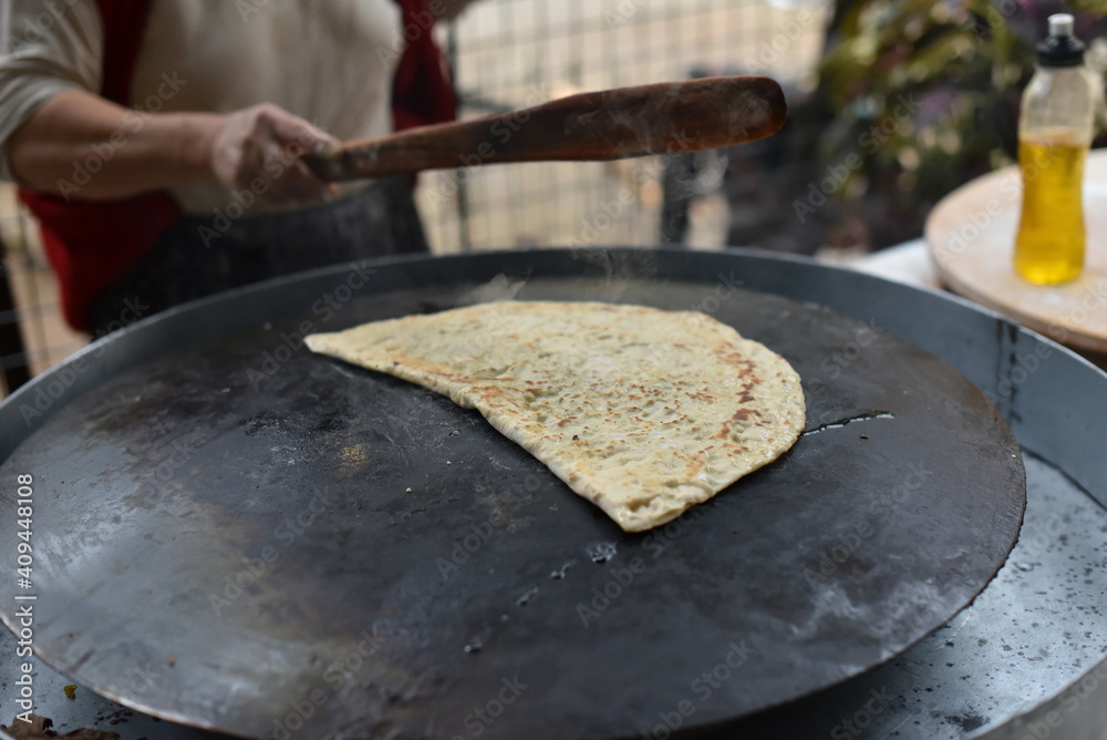 Turkish Food. Gozleme (Turkish stuffed flatbread) cooking process in ...