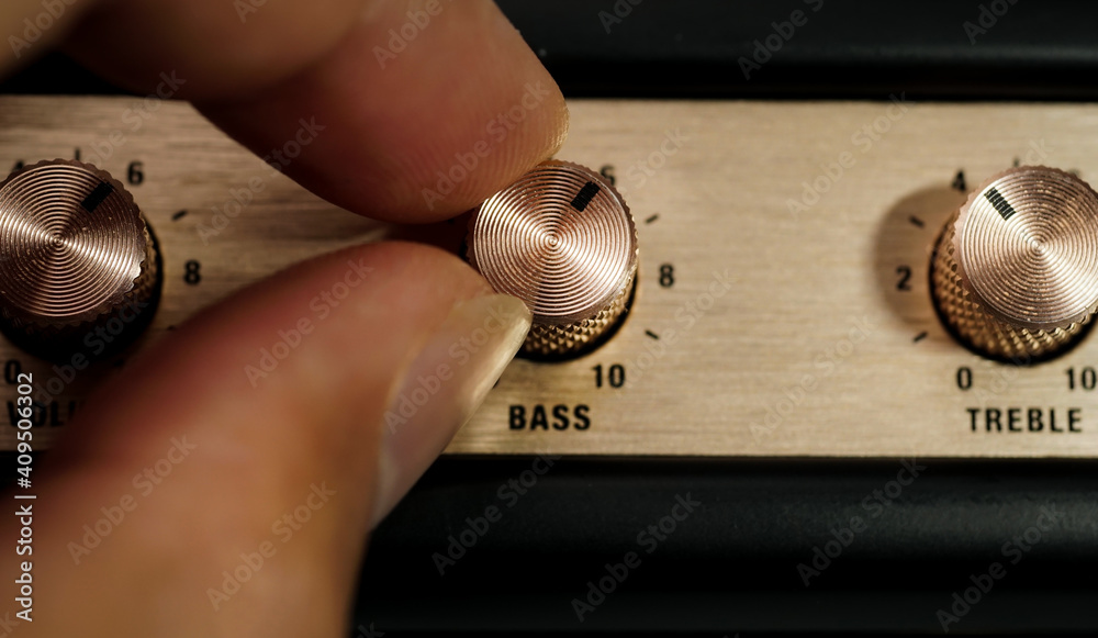 Hand adjusting volume control.Use hand to adjust the volume at the ...