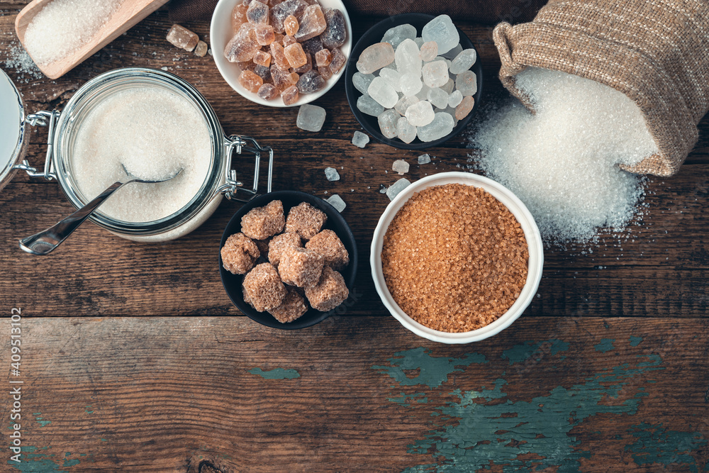 Assortment of sugar of different types and varieties on a wooden ...