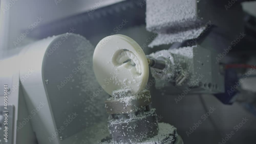 A professional CNC machine automatically creates a tooth prosthesis ...