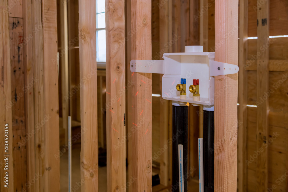 Installation of a laundry outlet boxes in a new house for connection of ...