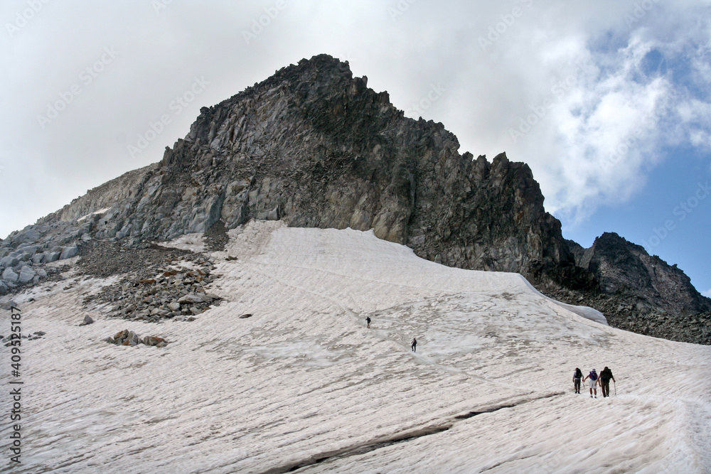 Mountaineers climbing at Mount Pico de Aneto in Huesca, Spain. Pico de ...