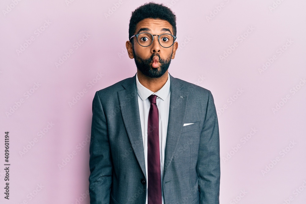 Handsome hispanic business man with beard wearing business suit and tie ...