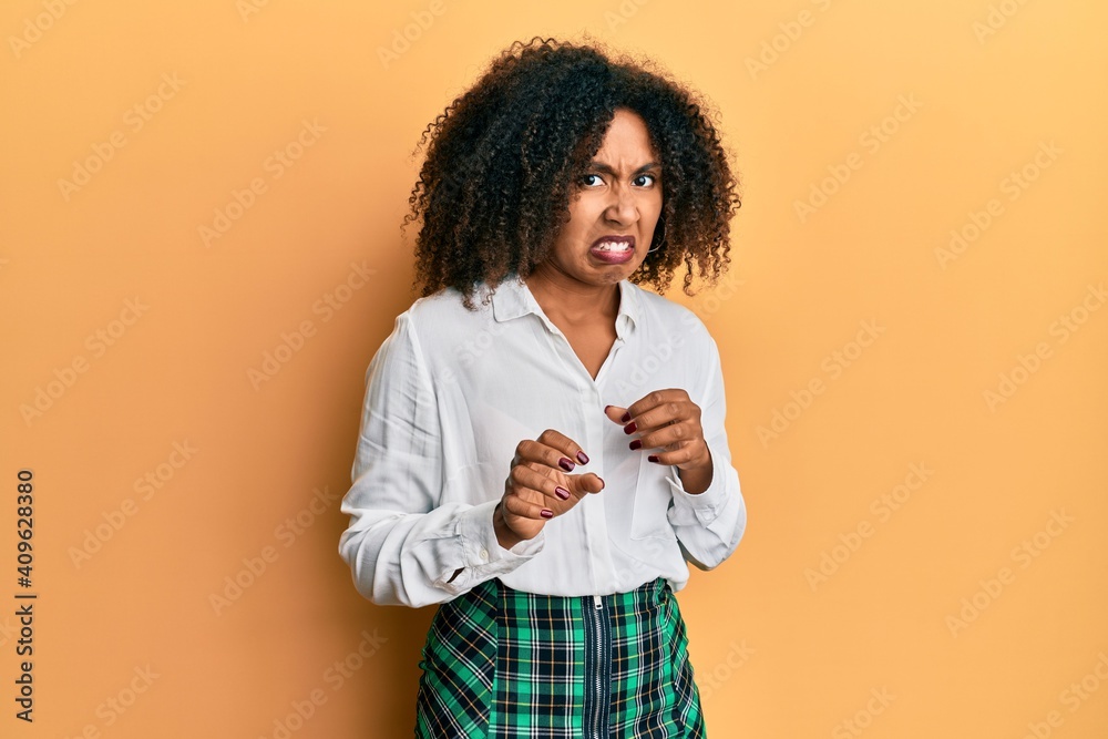 Beautiful african american woman with afro hair wearing scholar skirt ...