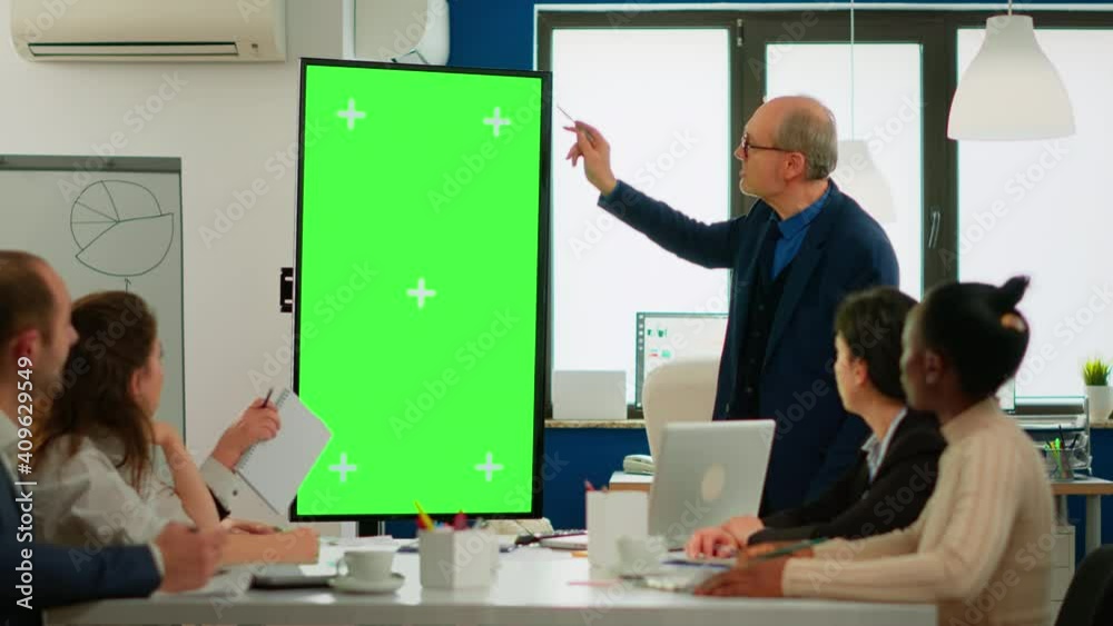 Mature businessman analysing annual financial reports standing in ...