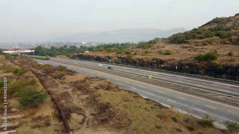 Aerial footage of the Mumbai-Pune Expressway near Pune India. The ...